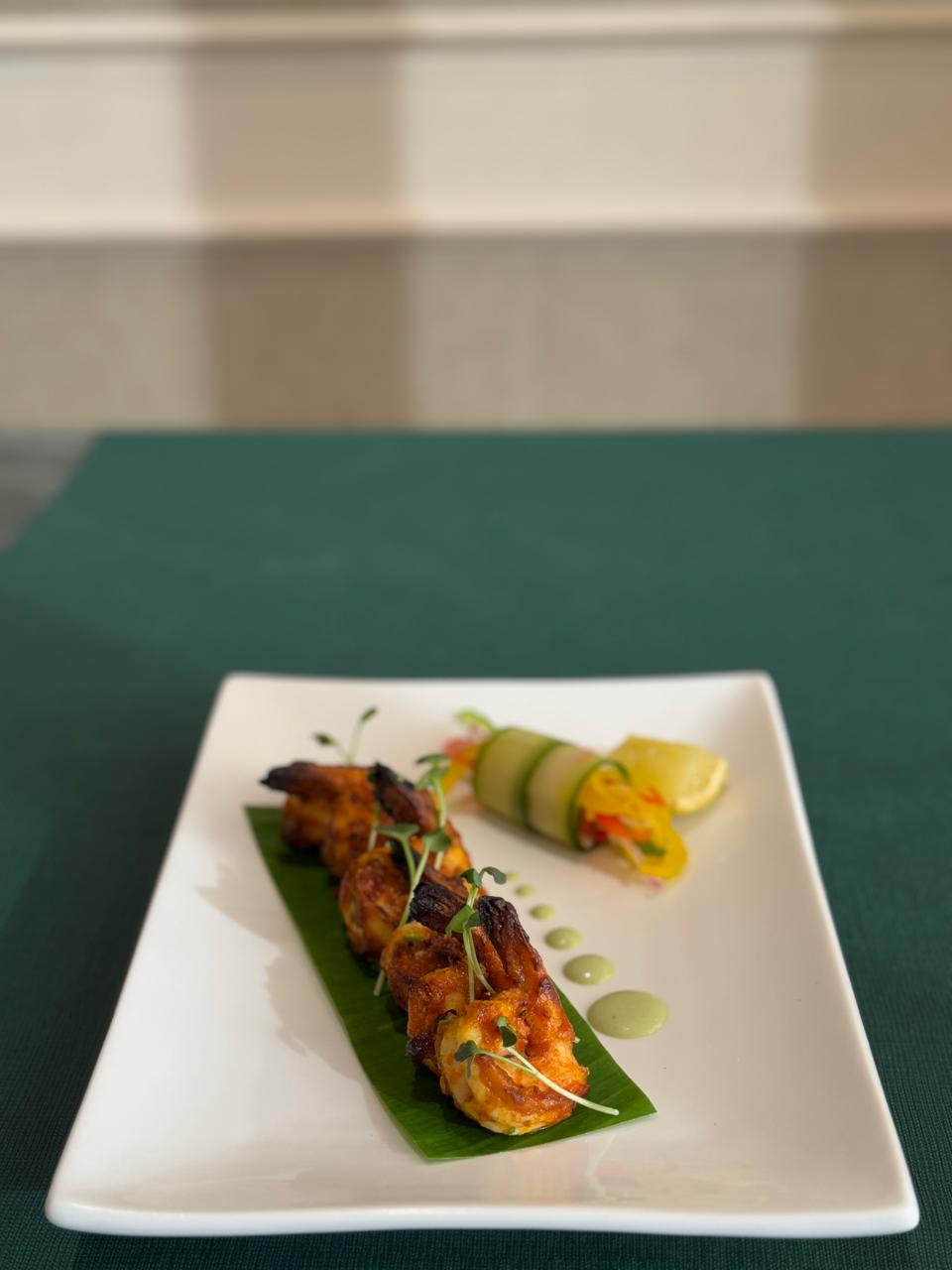 Zaffrani lasooni jhinga – Malt and Masala Restaurant Dev